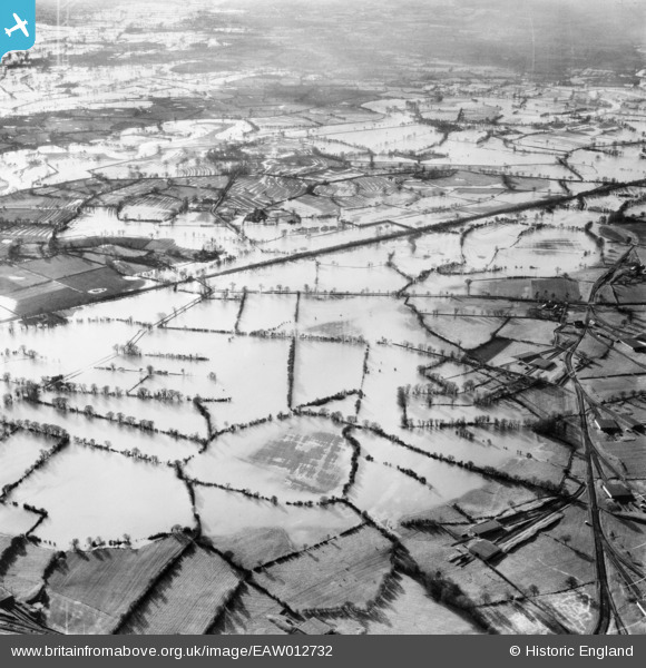 EAW012732 ENGLAND (1948). Flooded fields on either side of the former ...