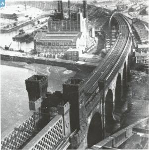 eaw046911 ENGLAND (1952). West Bank Dock Estate and the railway viaduct ...